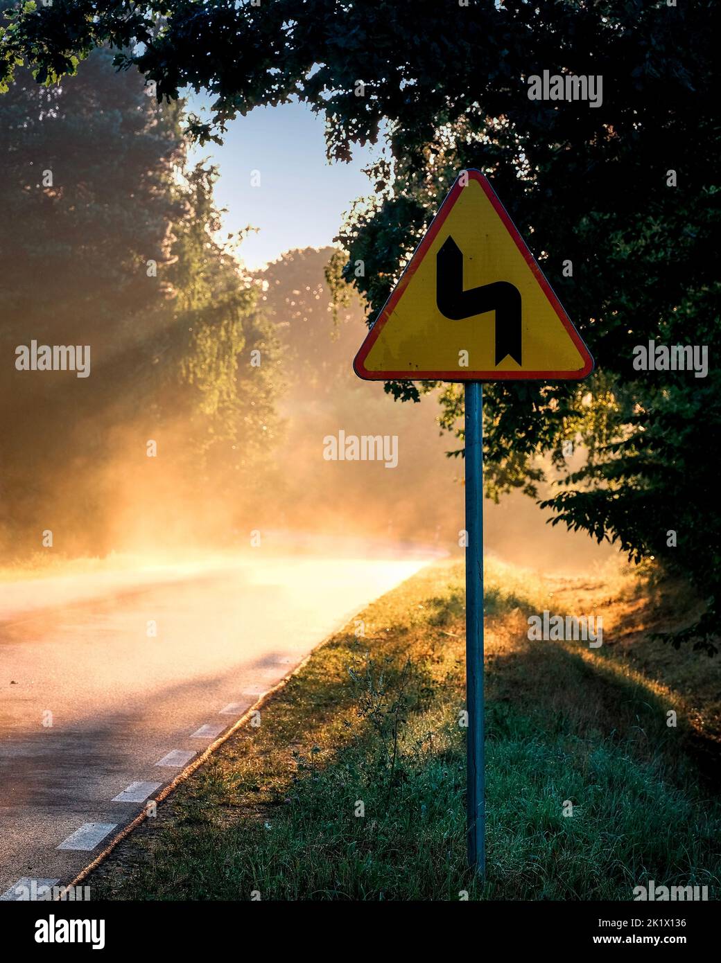 Double curve road traffic sign hi-res stock photography and images - Alamy
