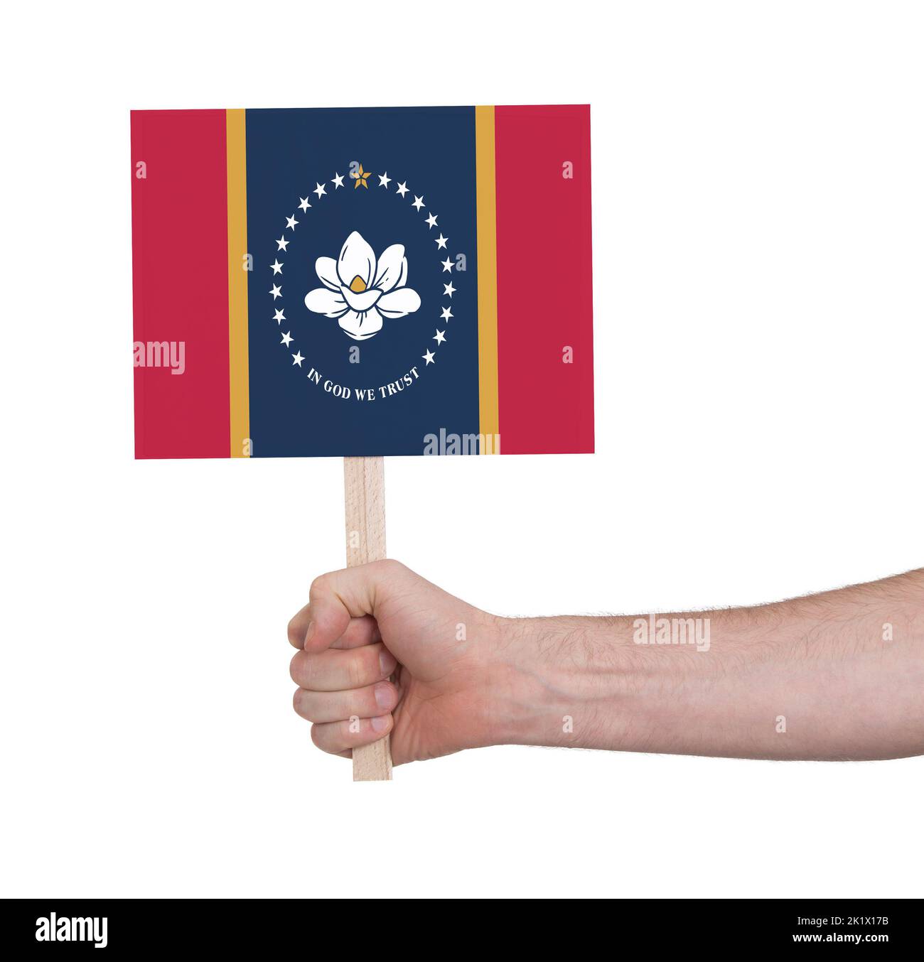 Hand holding banner on wood stick, isolated - Flag of Mississippi Stock ...