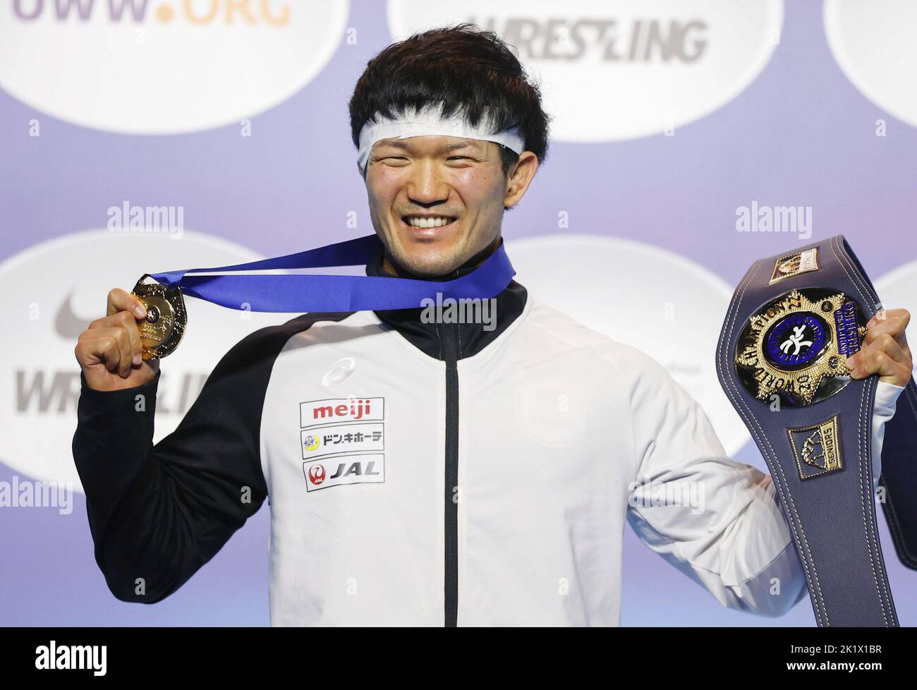 Japan's Taishi Narikuni poses with the gold medal around his neck after ...