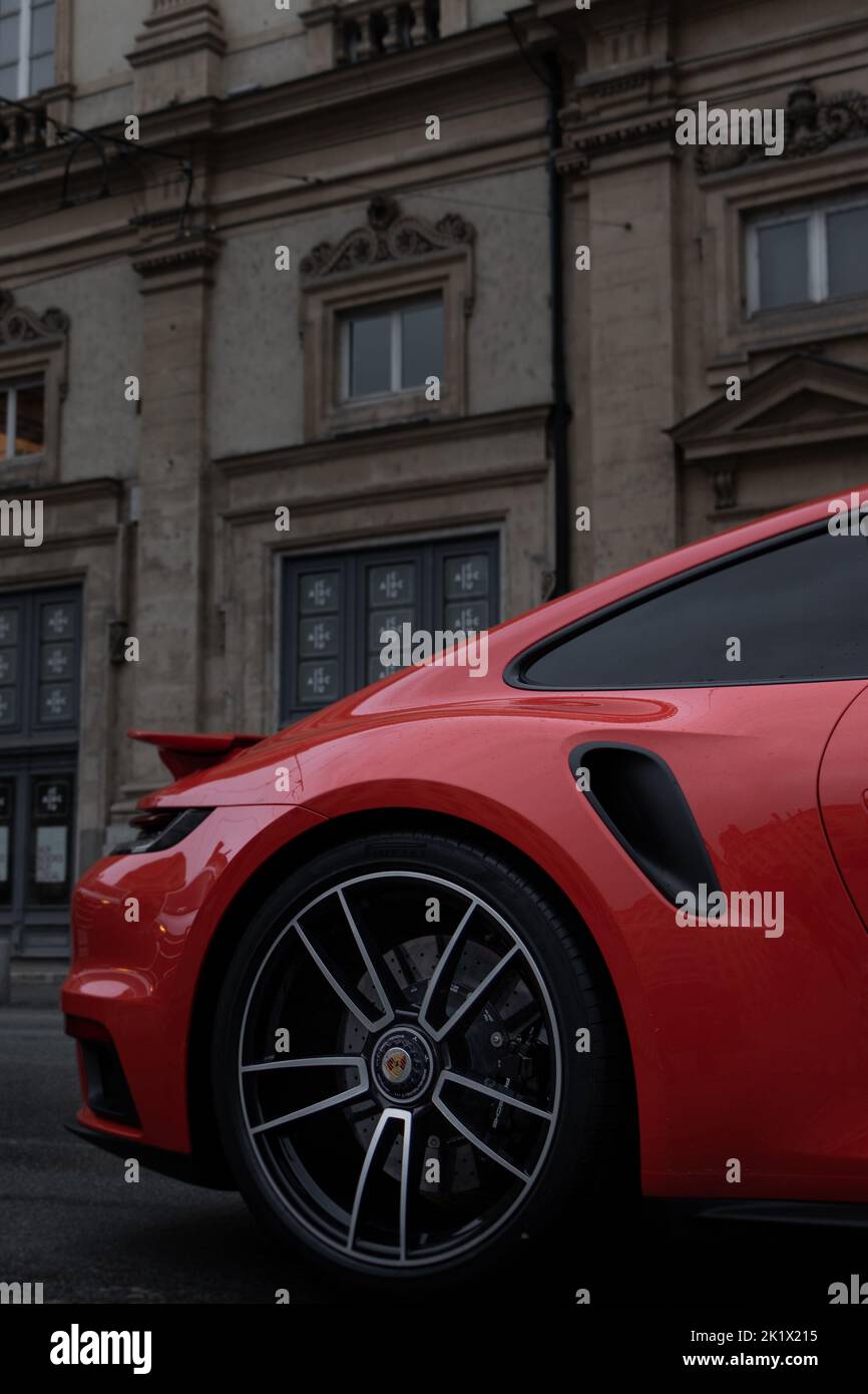 A side view of the red Porsche luxury car Stock Photo - Alamy