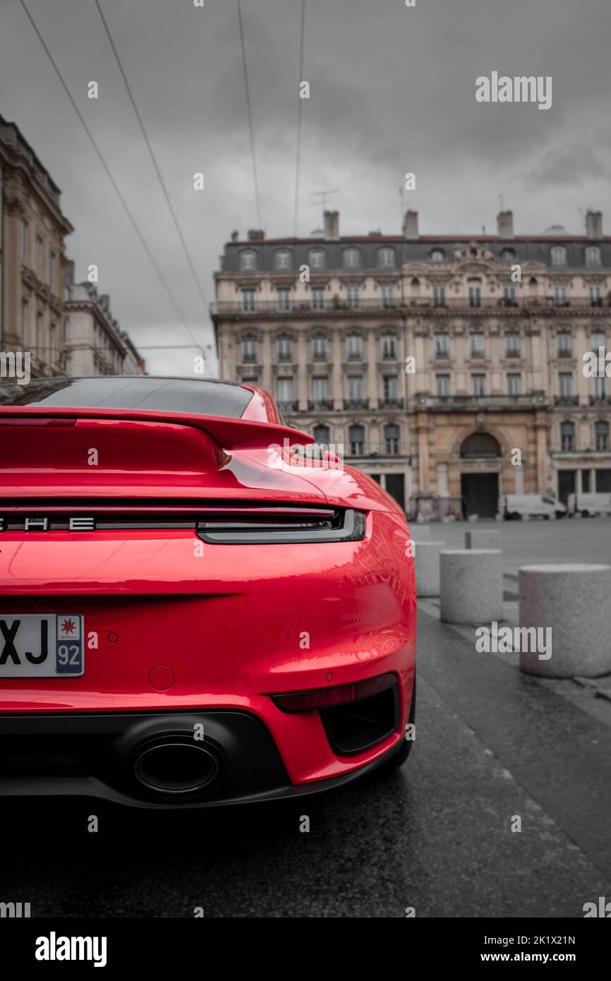 A back view of the red Porsche luxury car Stock Photo - Alamy
