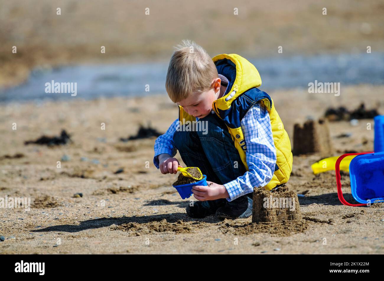 Boy building sandcastles hi-res stock photography and images - Alamy