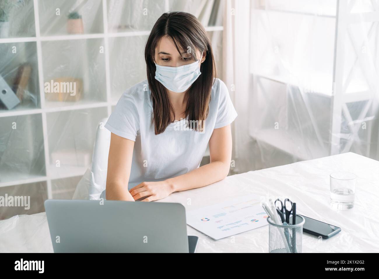 Office quarantine. Remote job. Pandemic self isolation. Female employee ...