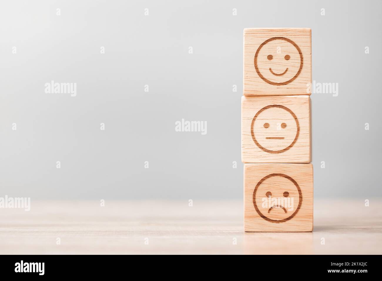 emotion face symbol on wooden blocks. Service rating, ranking, customer ...