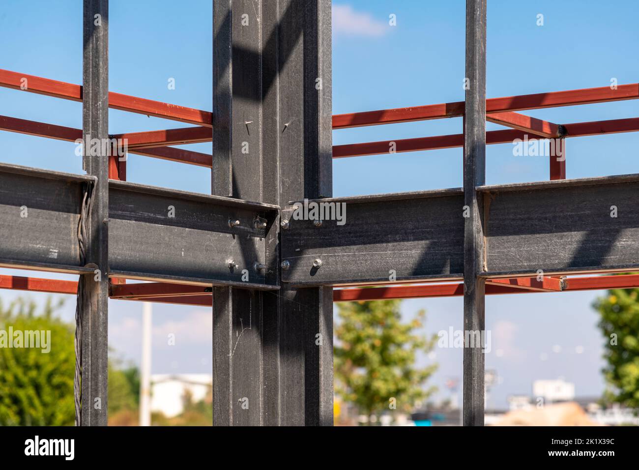 Structural steel beam connections, metal column supporting the roof construction. Structural ...