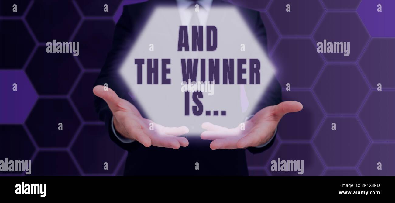 Writing displaying text And The Winner Is.... Business approach ...