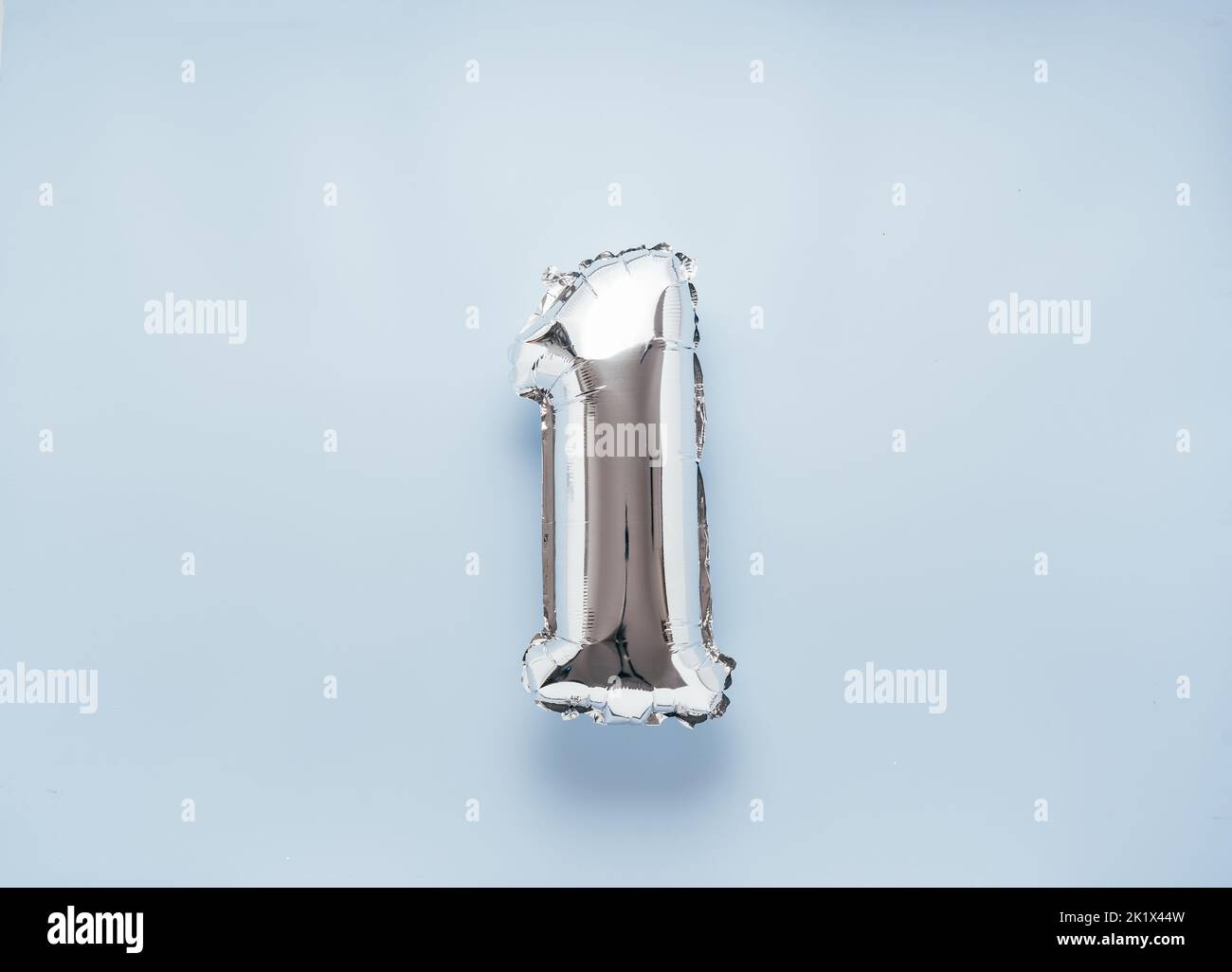 Silber balloon number 1 on light blue background for your New Year of ...