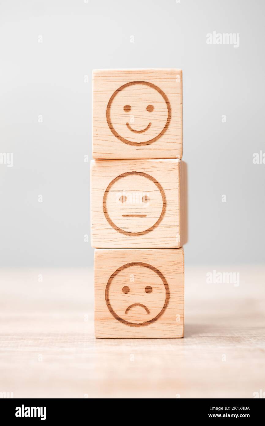 emotion face symbol on wooden blocks. Service rating, ranking, customer ...