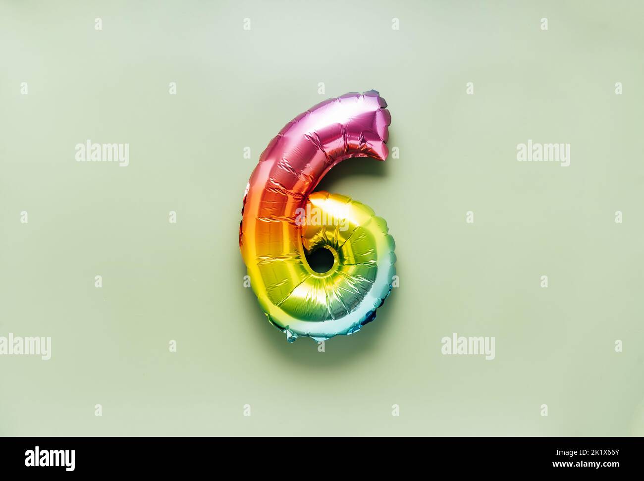 Colorful balloon number 6 on light green background. New Year of ...