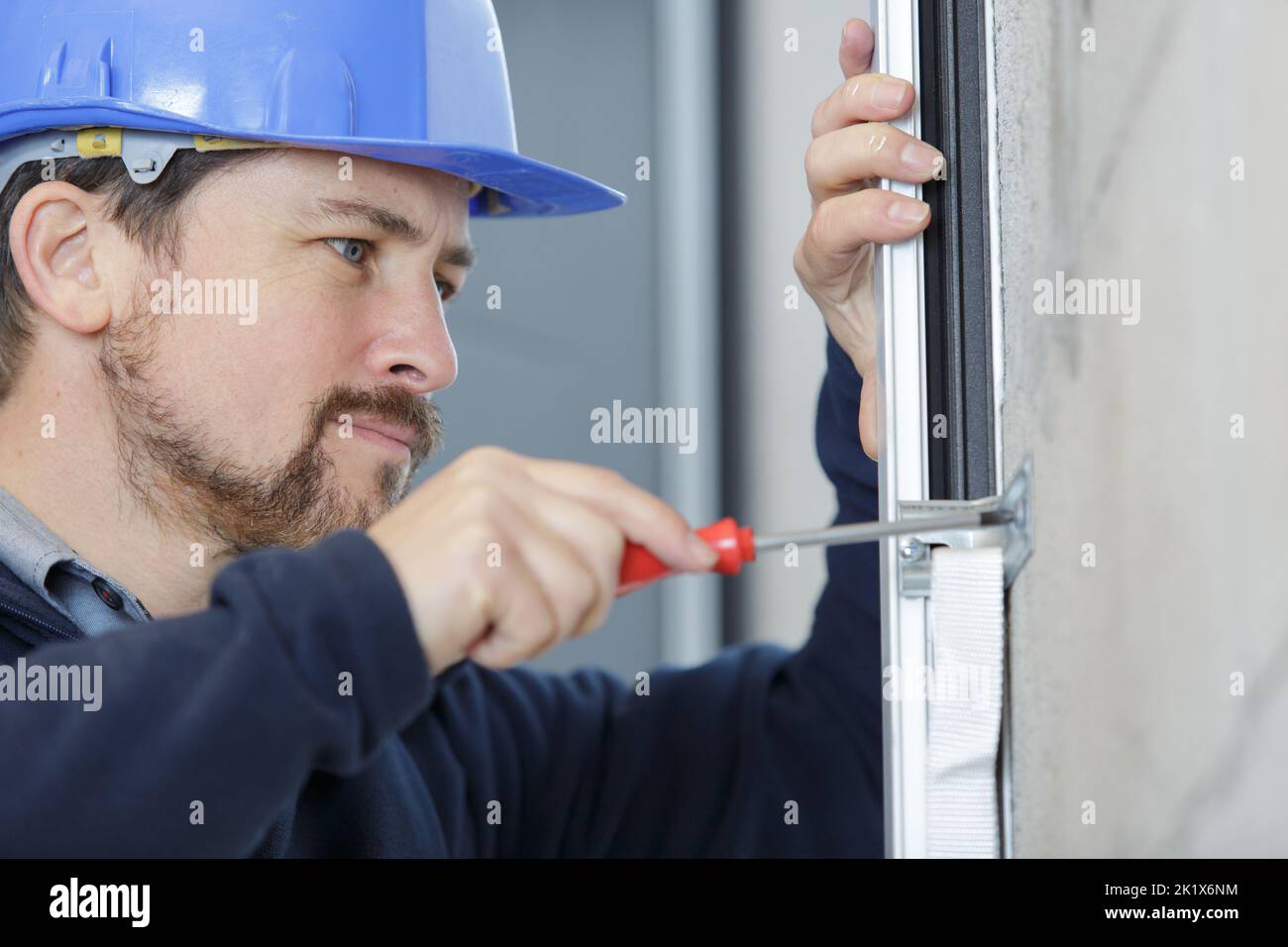 Skilled service worker using screwdriver hi-res stock photography and ...
