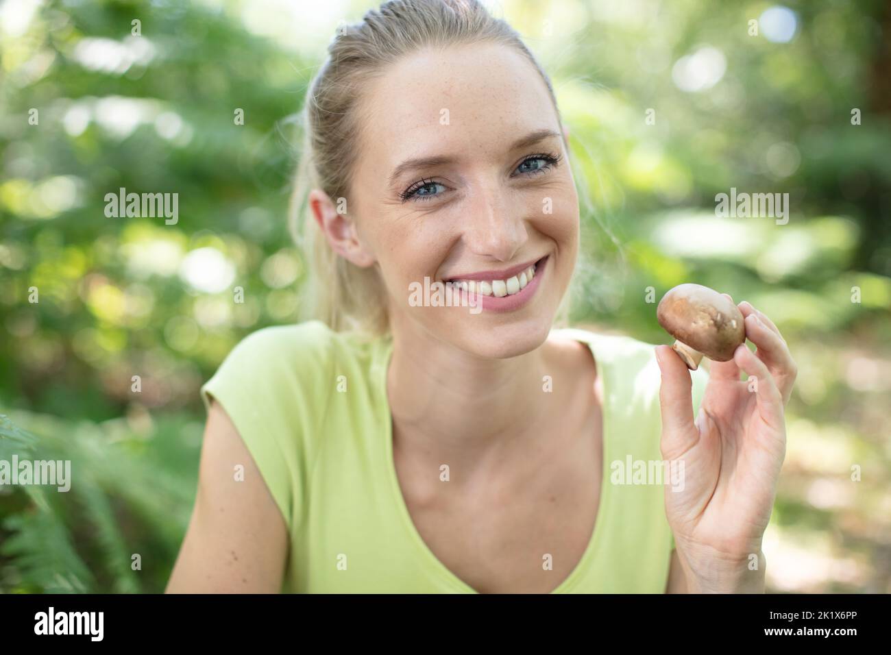 beautiful girl in autumn forest holding mushrooms in her hands Stock ...