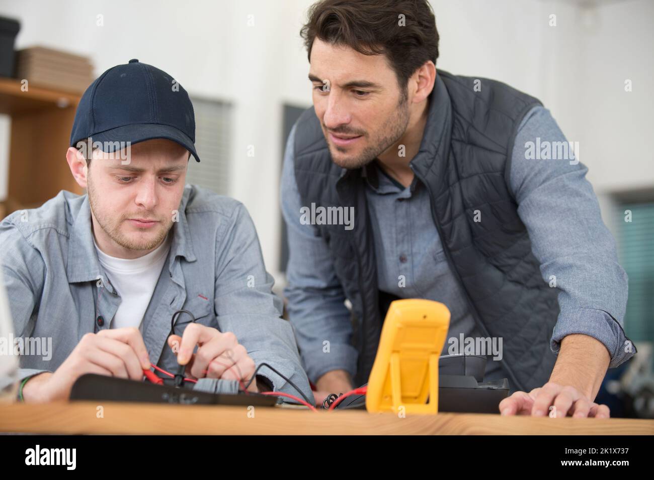 a craftsman and his young apprentice at work Stock Photo - Alamy
