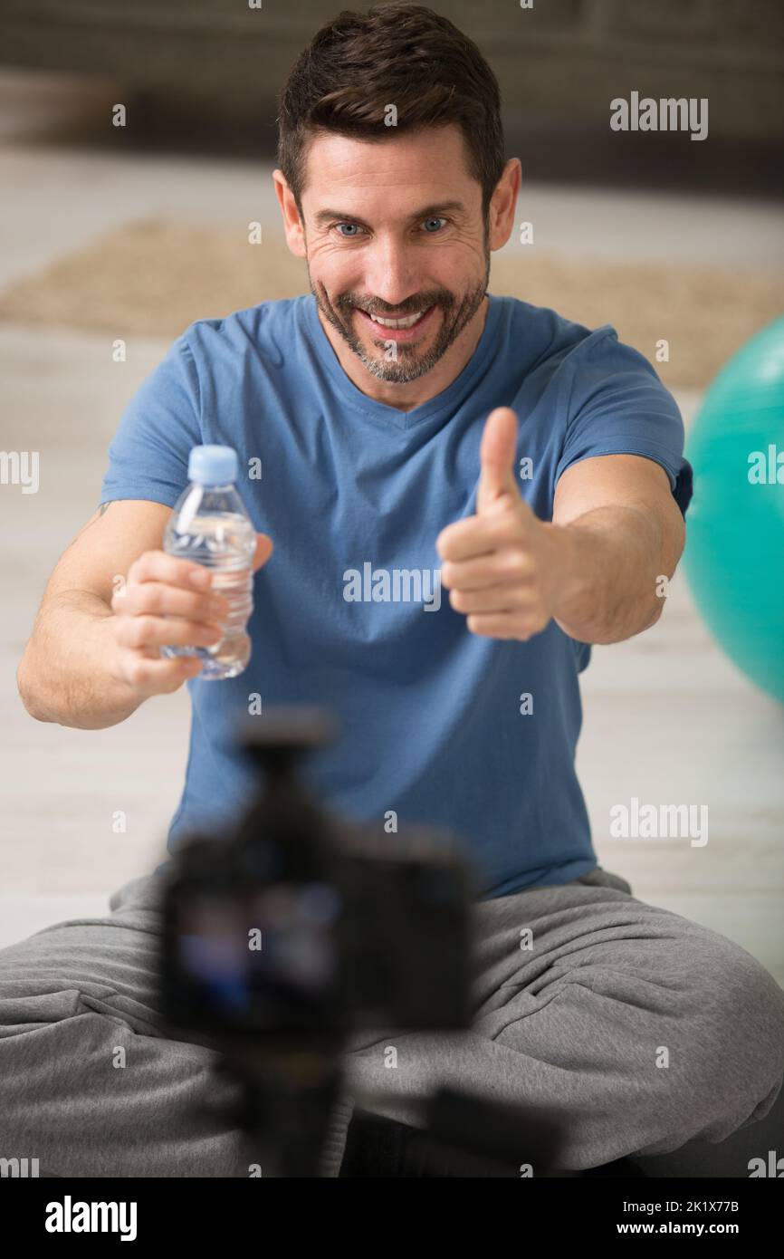 man showing thumb up while exercising at the gym Stock Photo - Alamy