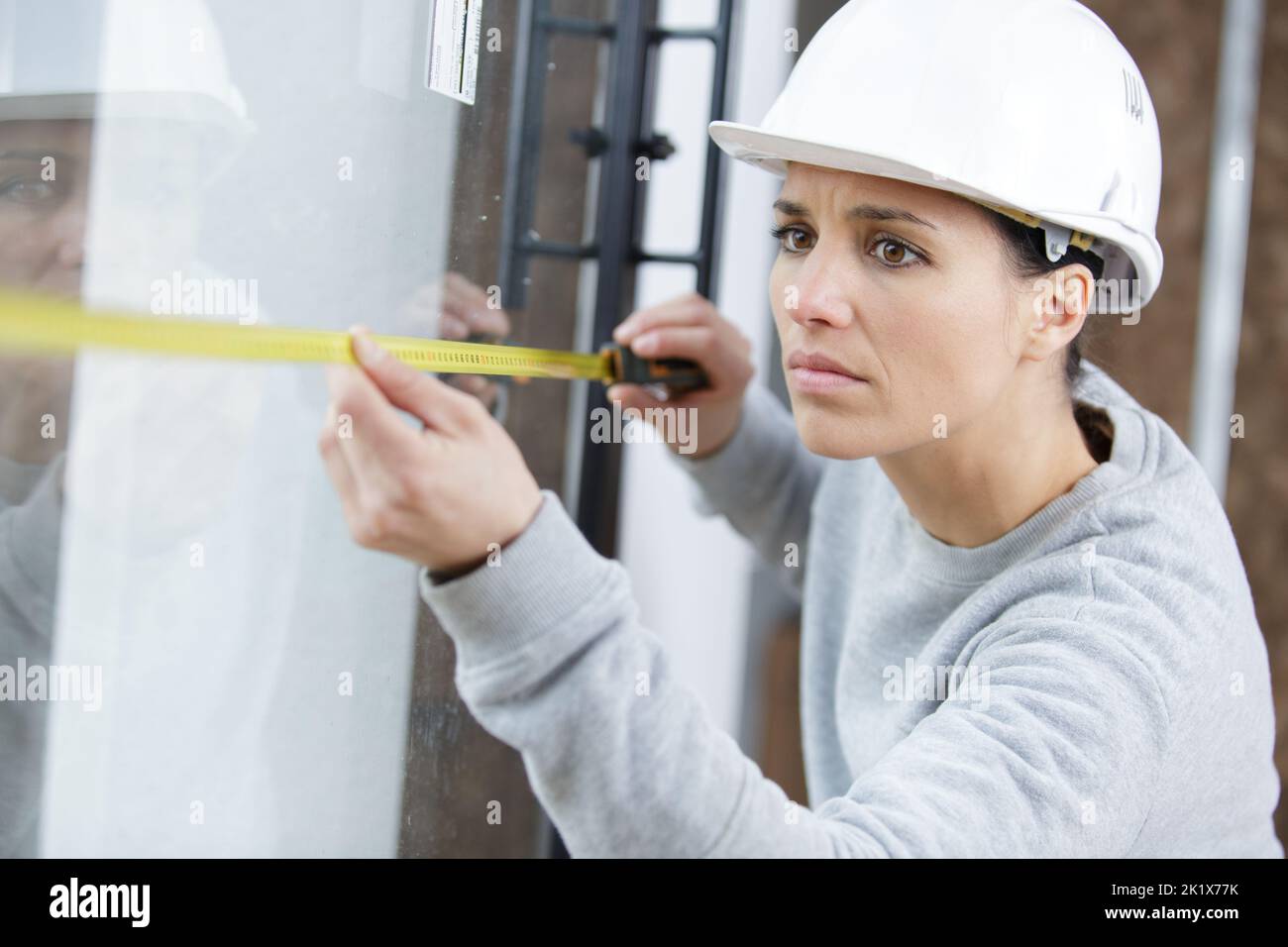 woman measuring window frame in construction site Stock Photo - Alamy woman measuring window frame in construction site Stock Photo - Alamy