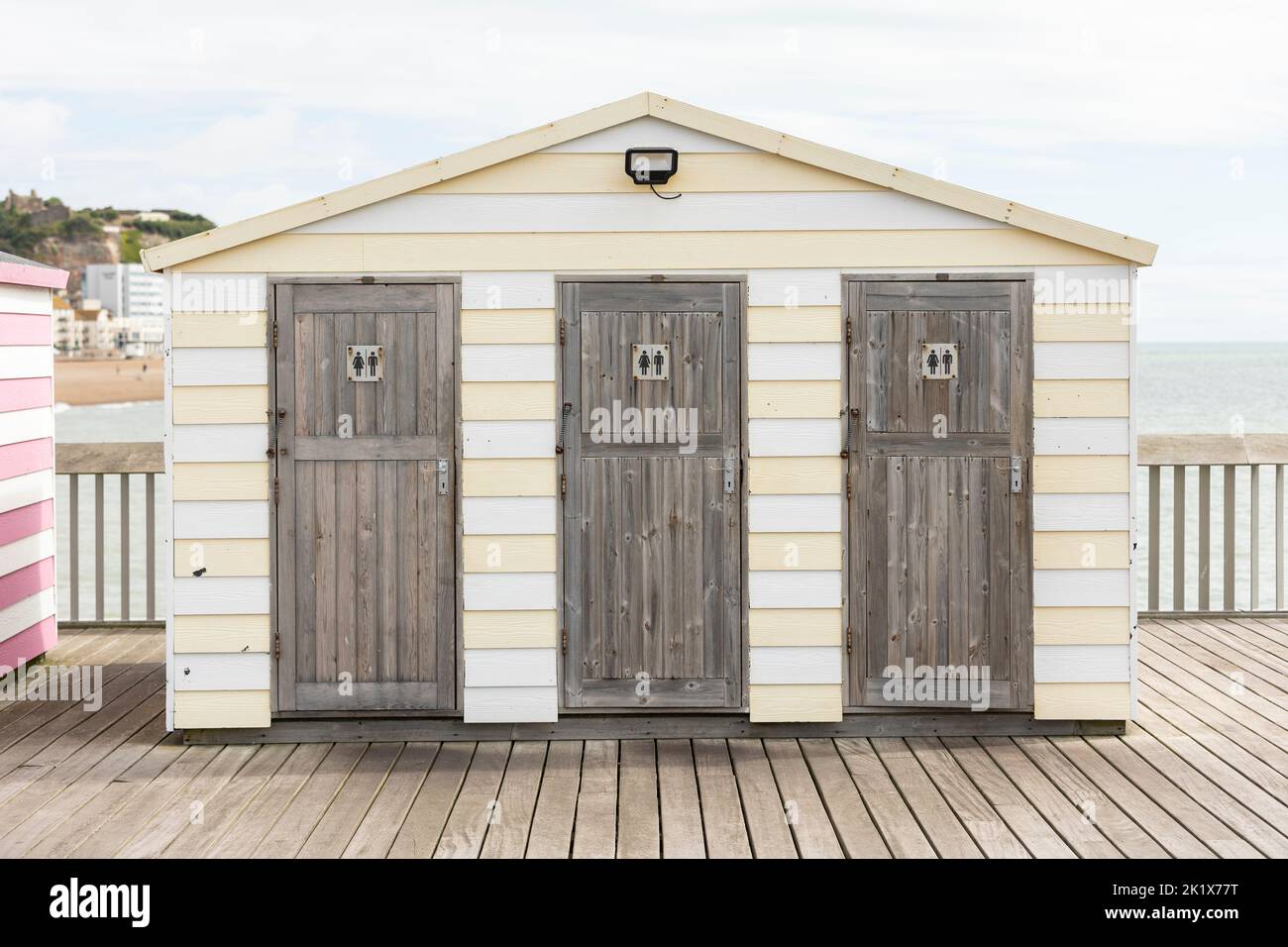 public toilets hastings pier, copy space Stock Photo - Alamy