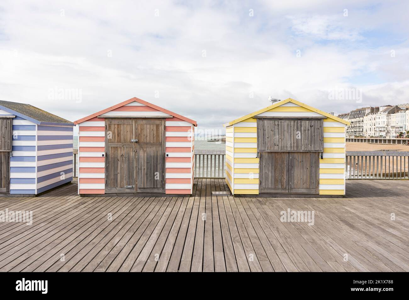 colourfull pier huts on hastings pier, copy space Stock Photo - Alamy