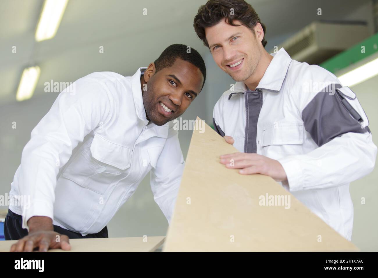 two carpenters working at workshop Stock Photo - Alamy