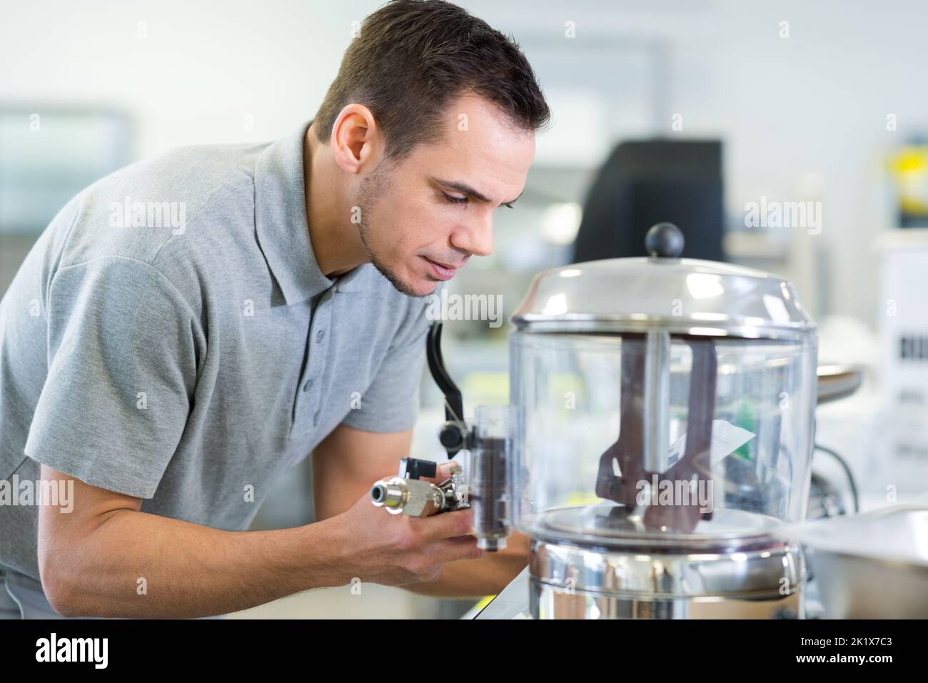 portrait of technician fixing a machine Stock Photo - Alamy