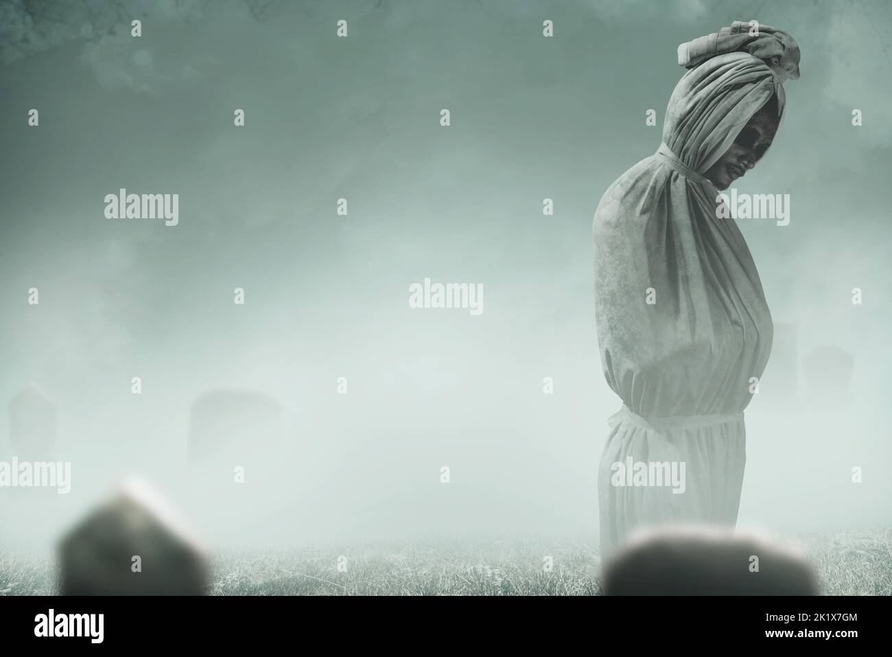 Pocong is covered with a white linen shroud standing in the cemetery ...