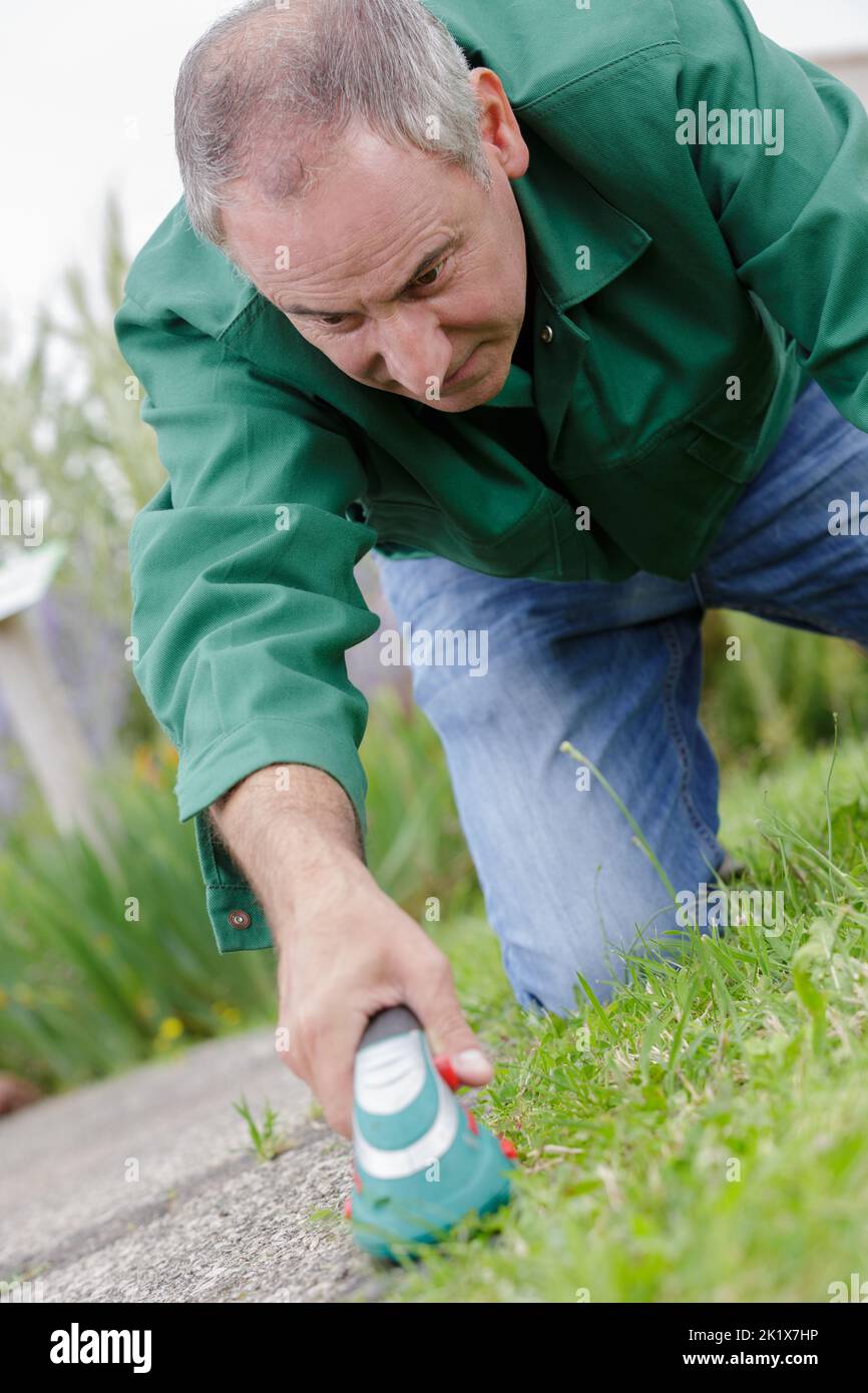 men face off cut the grass cut the grass Stock Photo - Alamy