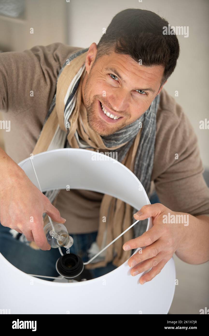 A man changing a light bulb hi-res stock photography and images - Alamy