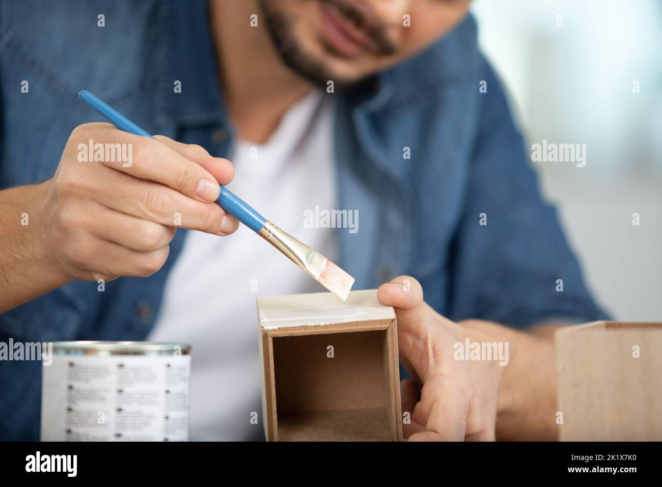 man creates a wood house for his children Stock Photo - Alamy