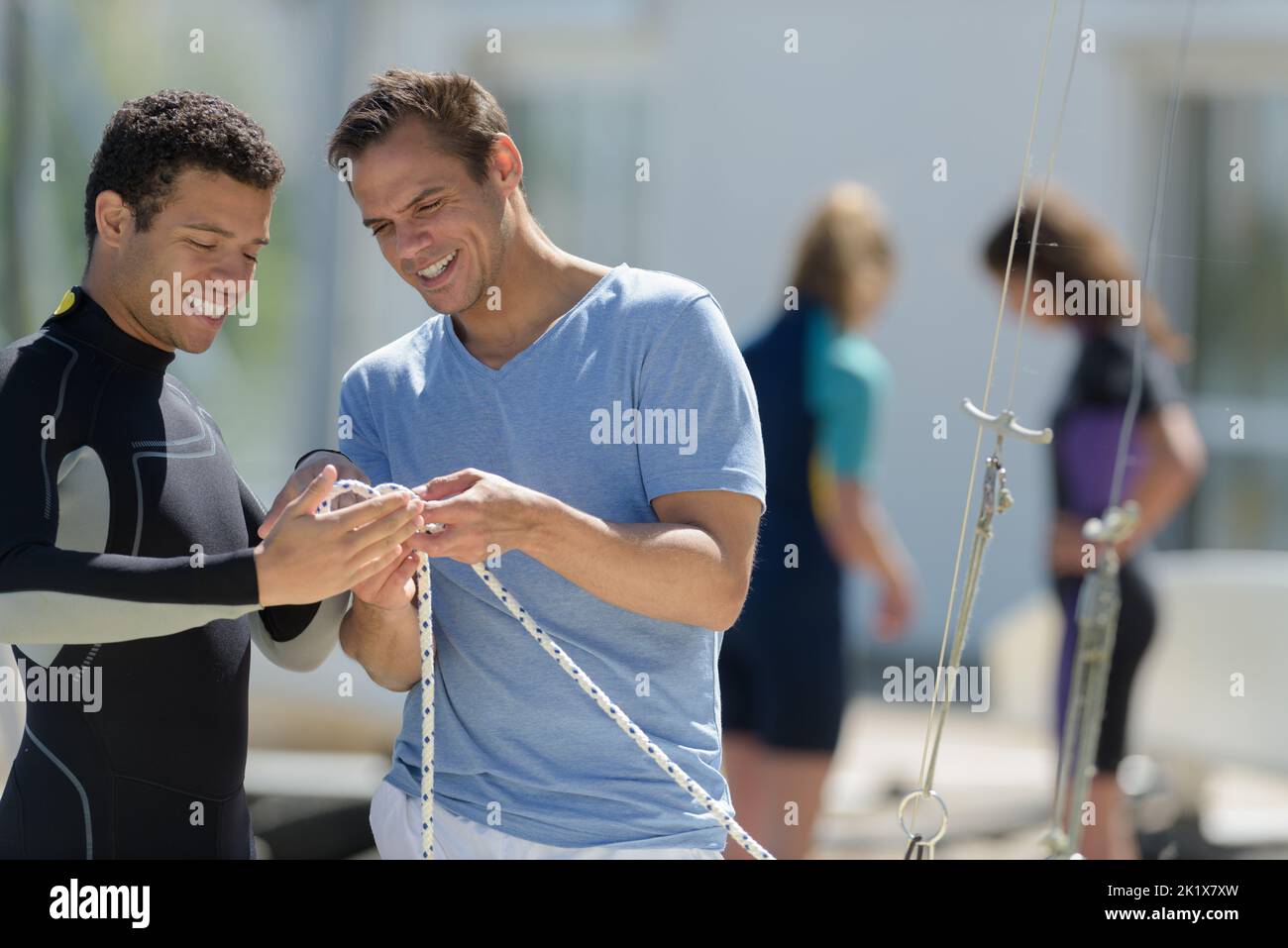 man learning to do sailing knot Stock Photo - Alamy