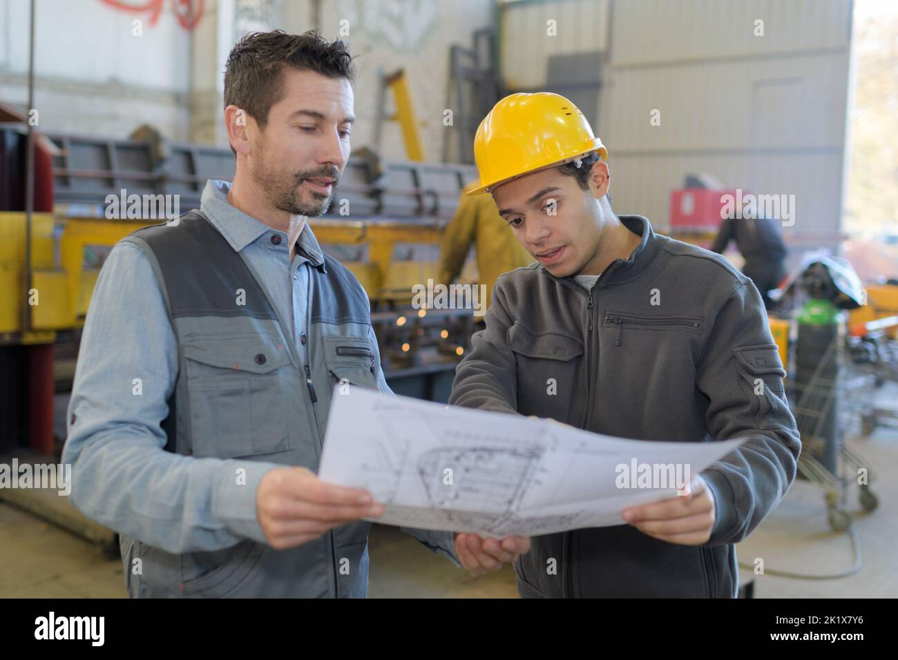 engineers working on project in metallurgy workshop Stock Photo - Alamy