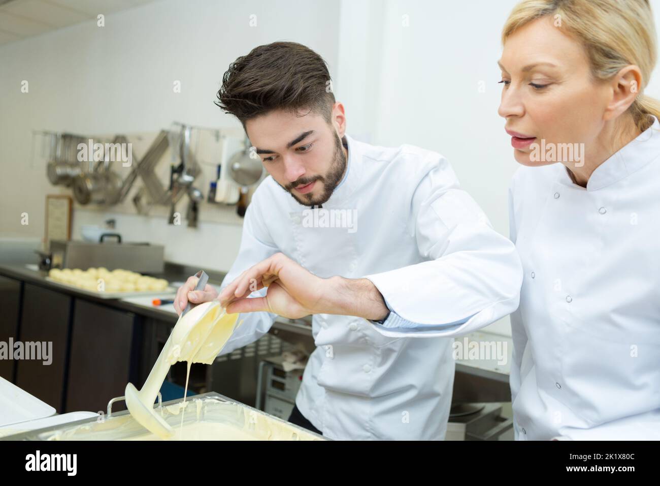 creative chef working with melted white chocolate Stock Photo - Alamy