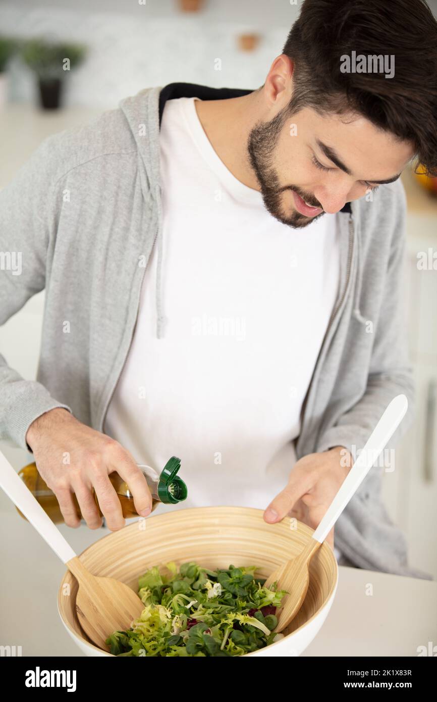 Male hand pouring vegetable oil hi-res stock photography and images - Alamy