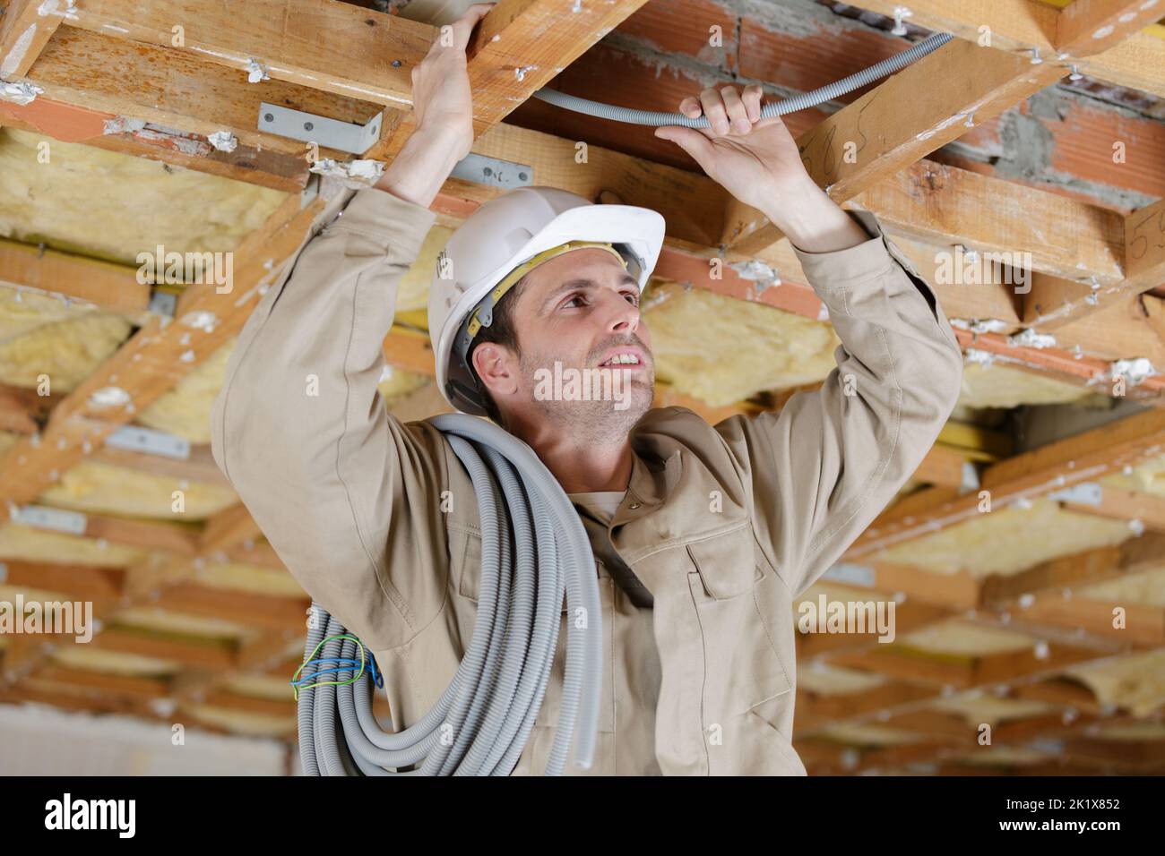 man in construction site wearing a hard hat Stock Photo - Alamy