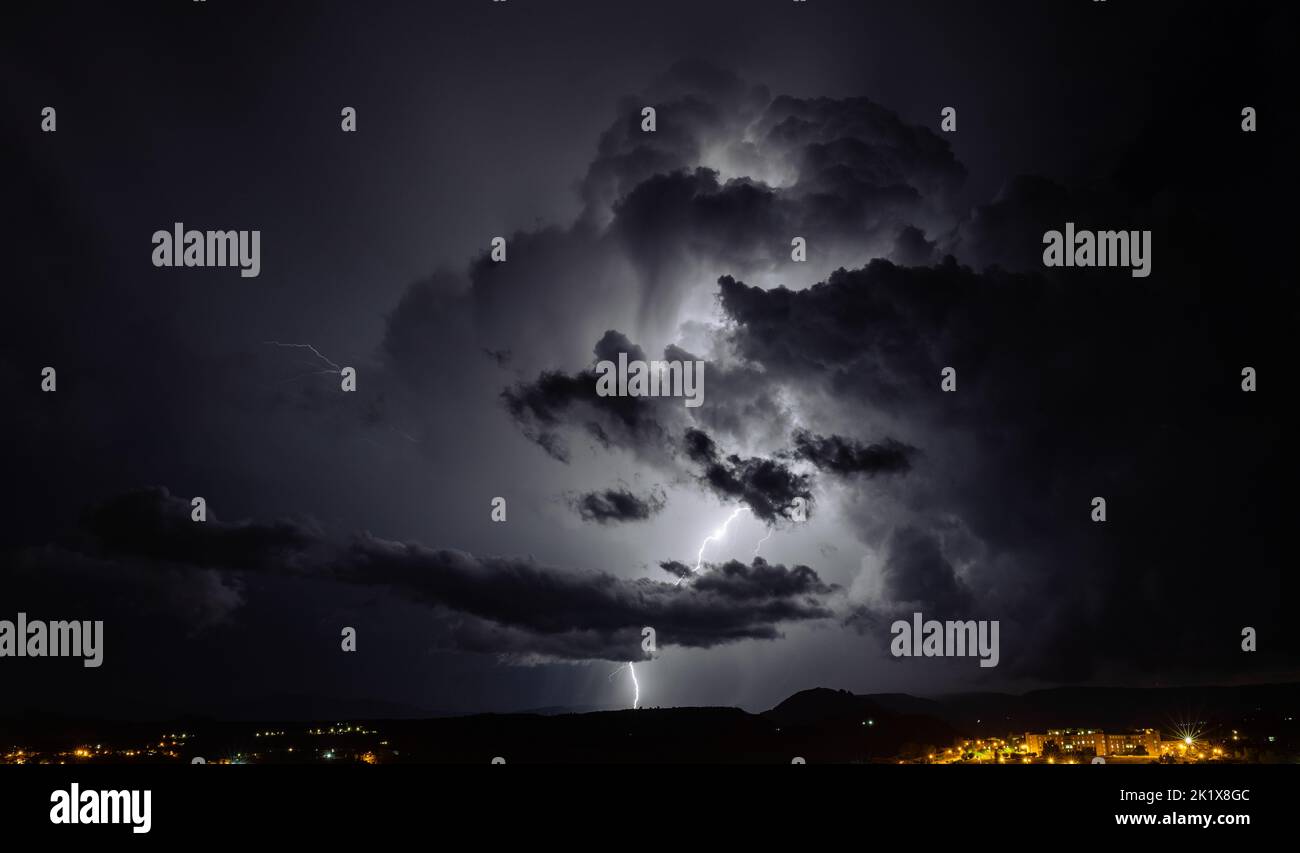Lightning with thundercloud at night Stock Photo - Alamy