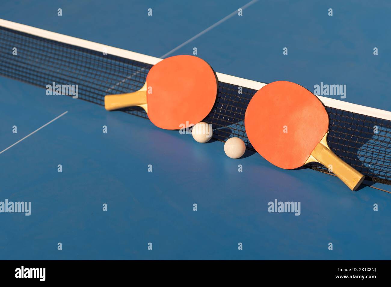 Ping pong table, rackets and balls Stock Photo - Alamy