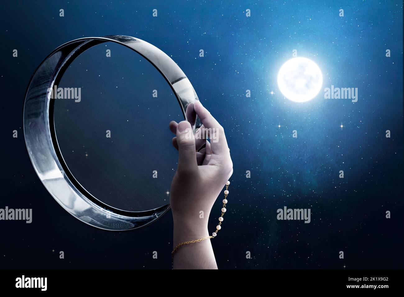 Woman hand holding Karwa Chauth strainer for the Karwa Chauth ...