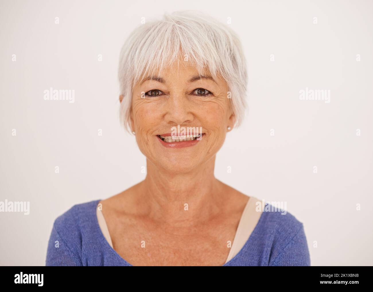 Its good to see you again. Portrait of a happy mature woman posing ...