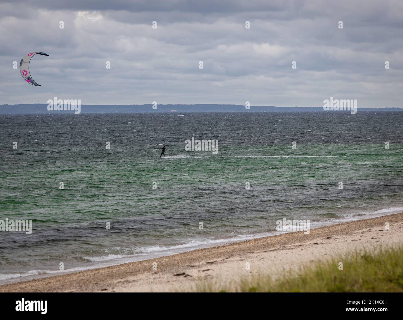 A kiteboarder enjoying a windy new England day off the coast of Marthas ...