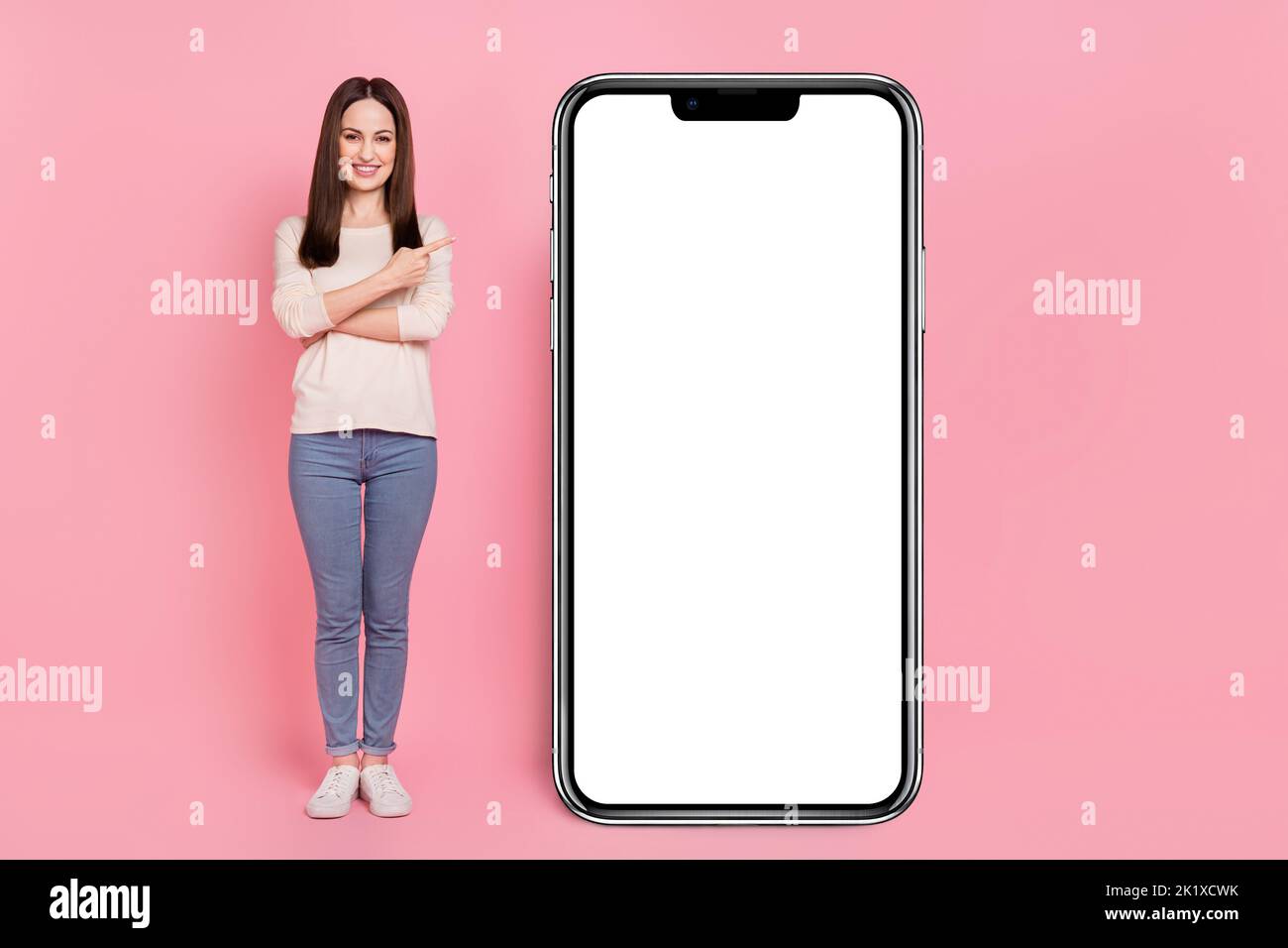 Business woman girl presenting huge large big cell phone touchscreen ...