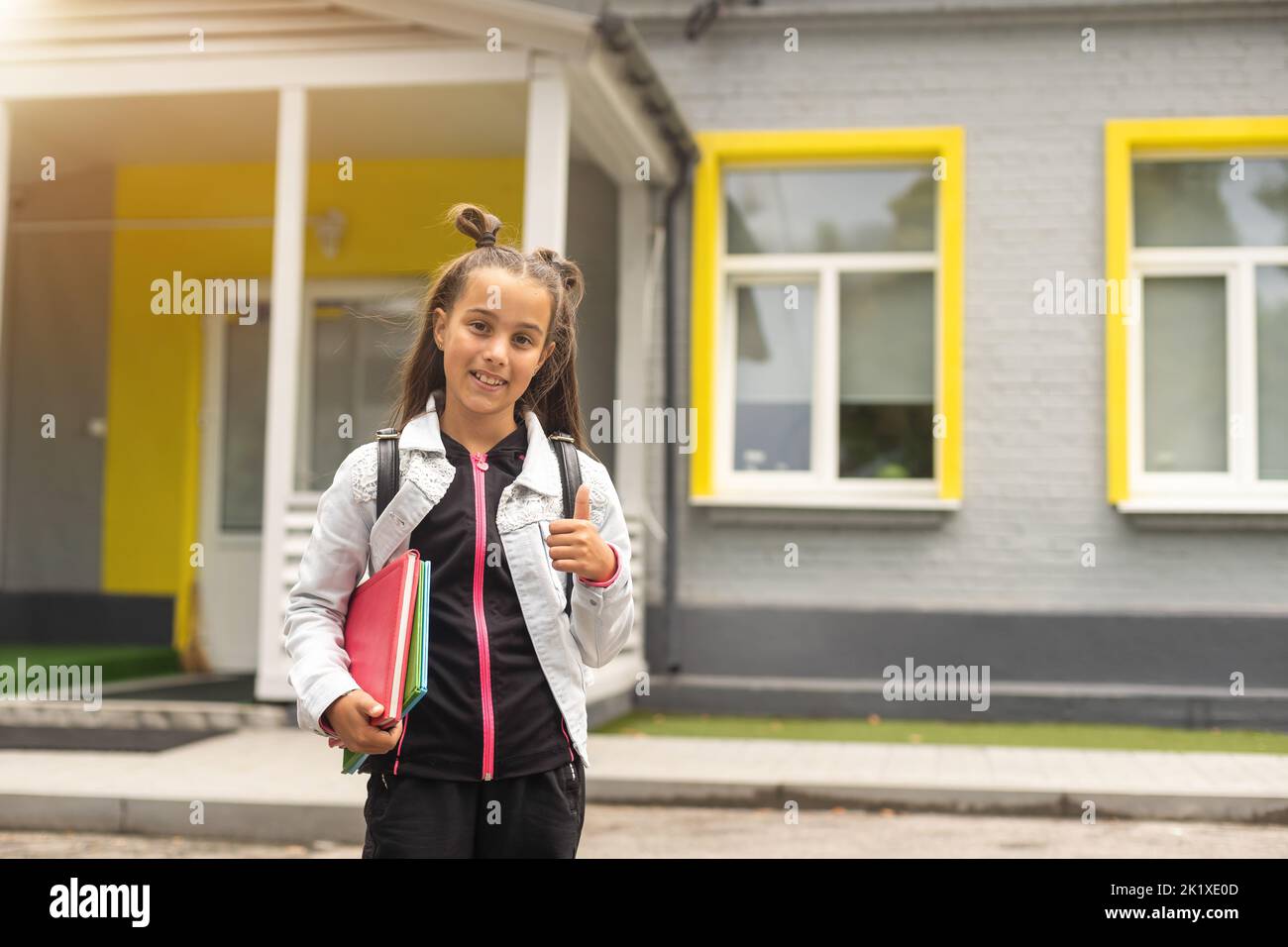 First day of school. Happy child girl elementary school student runs to ...