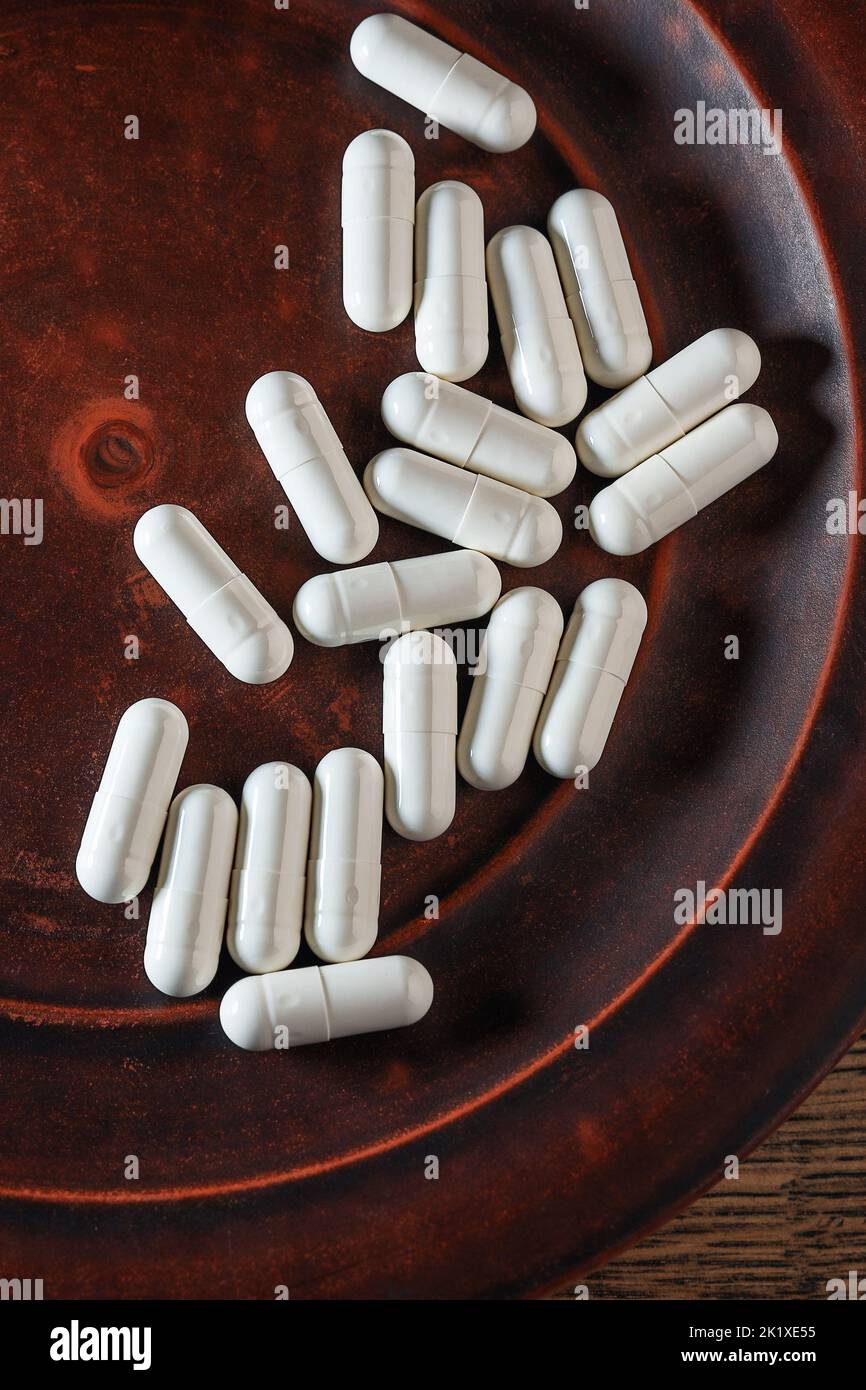 pills top view. monolaurin dietary supplement topview. immune health ...