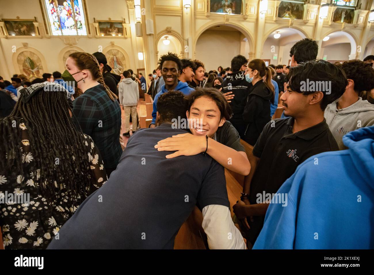 Students seen hugging after the liturgy at St Joseph Basilica. In the ...