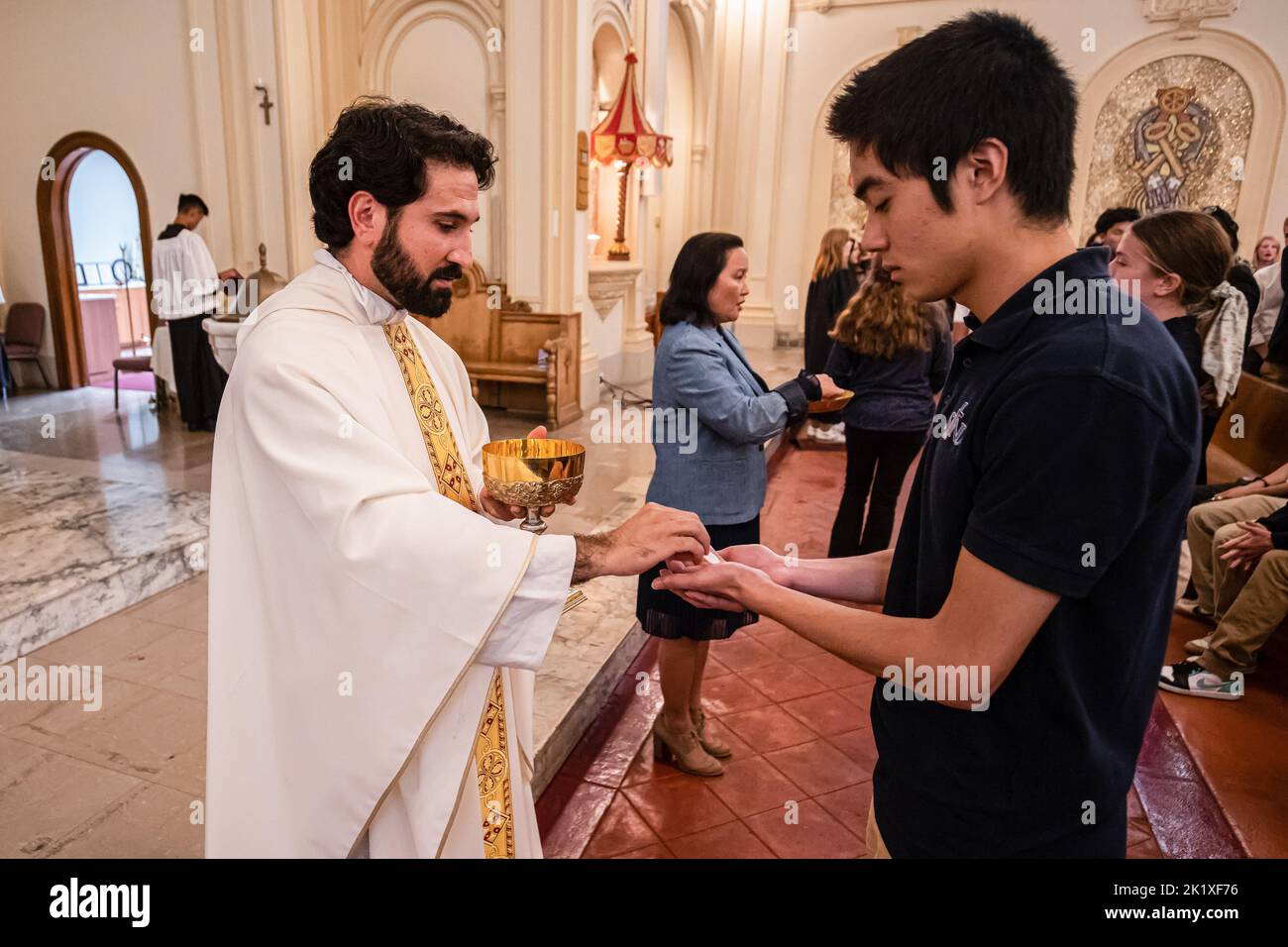 Students receive holy communion during the liturgy at St Joseph ...