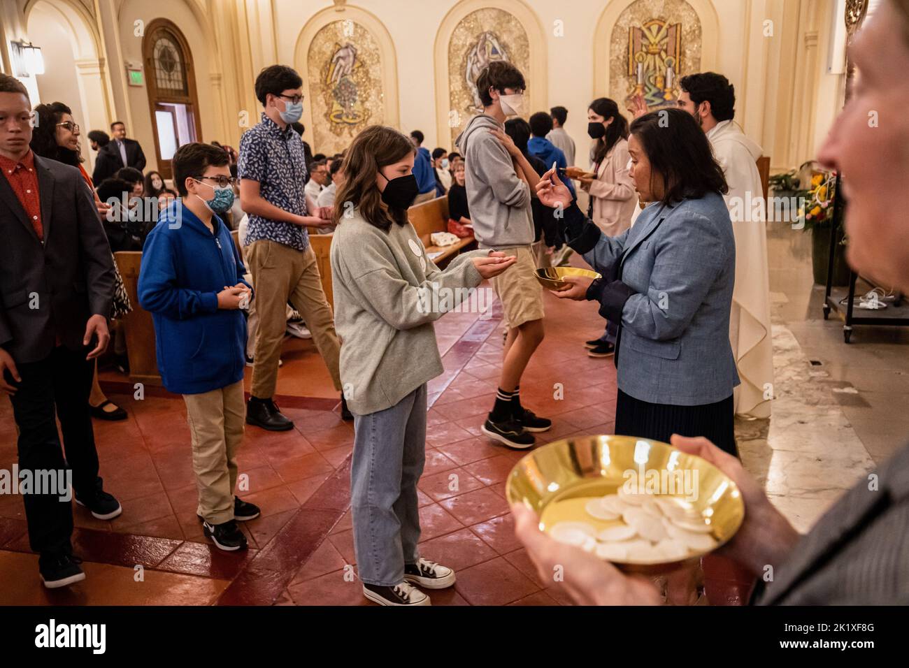 Students receive holy communion during the liturgy at St Joseph ...