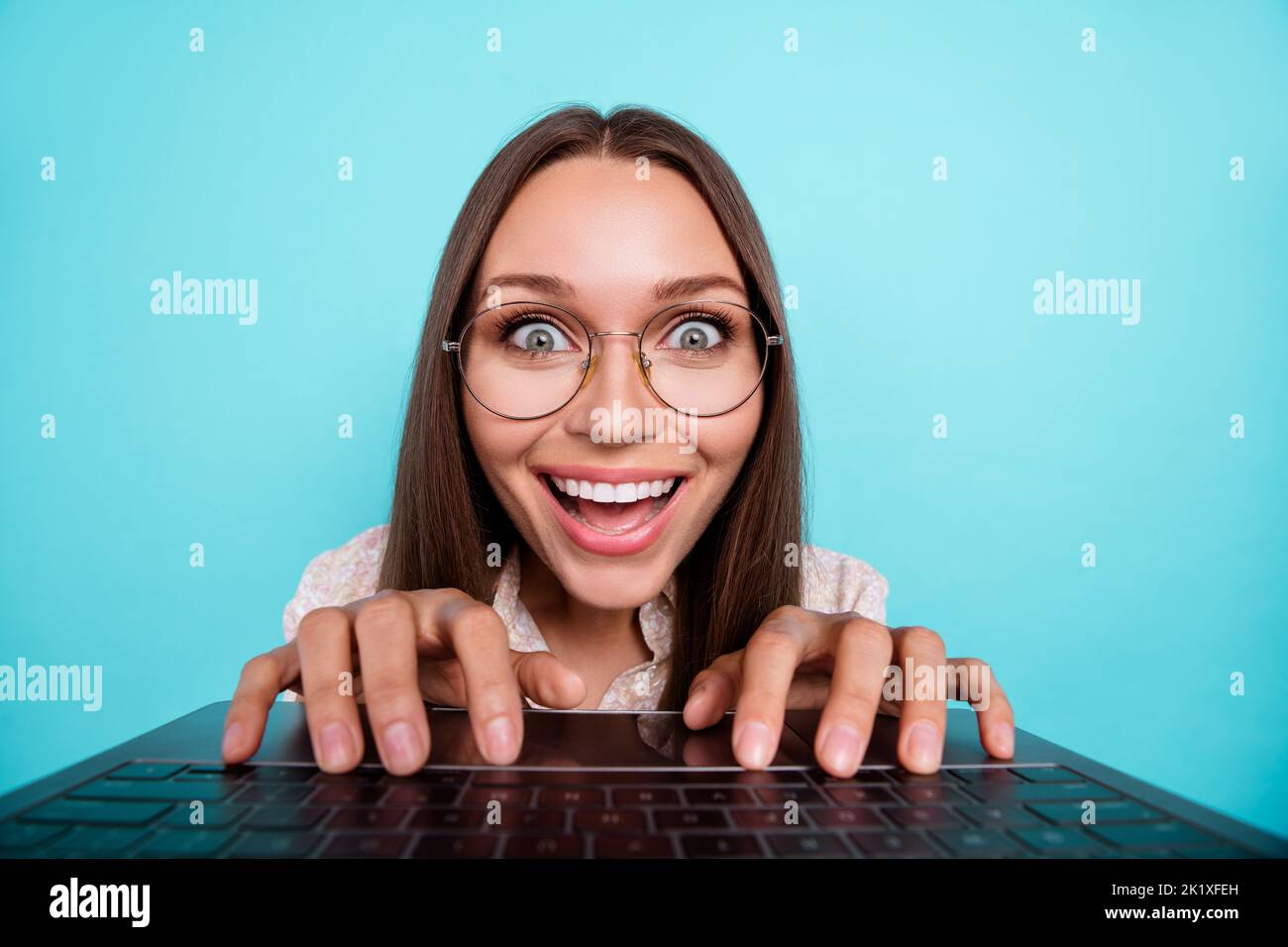 Photo of impressed millennial woman type keyboard wear spectacles ...