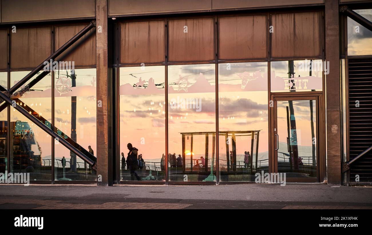 Sunset reflected in window on Blackpool seafront Stock Photo - Alamy