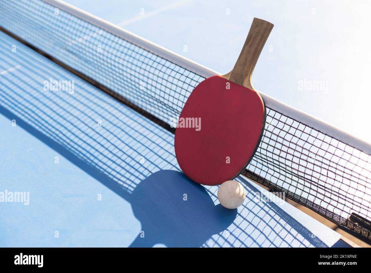 Ping pong table, rackets and balls in a sport hall Stock Photo - Alamy