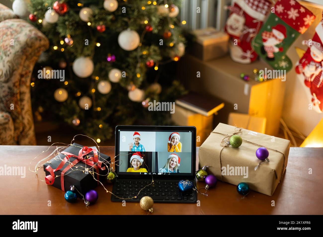 Family video call with kid presenting gift by remote chat digital ...