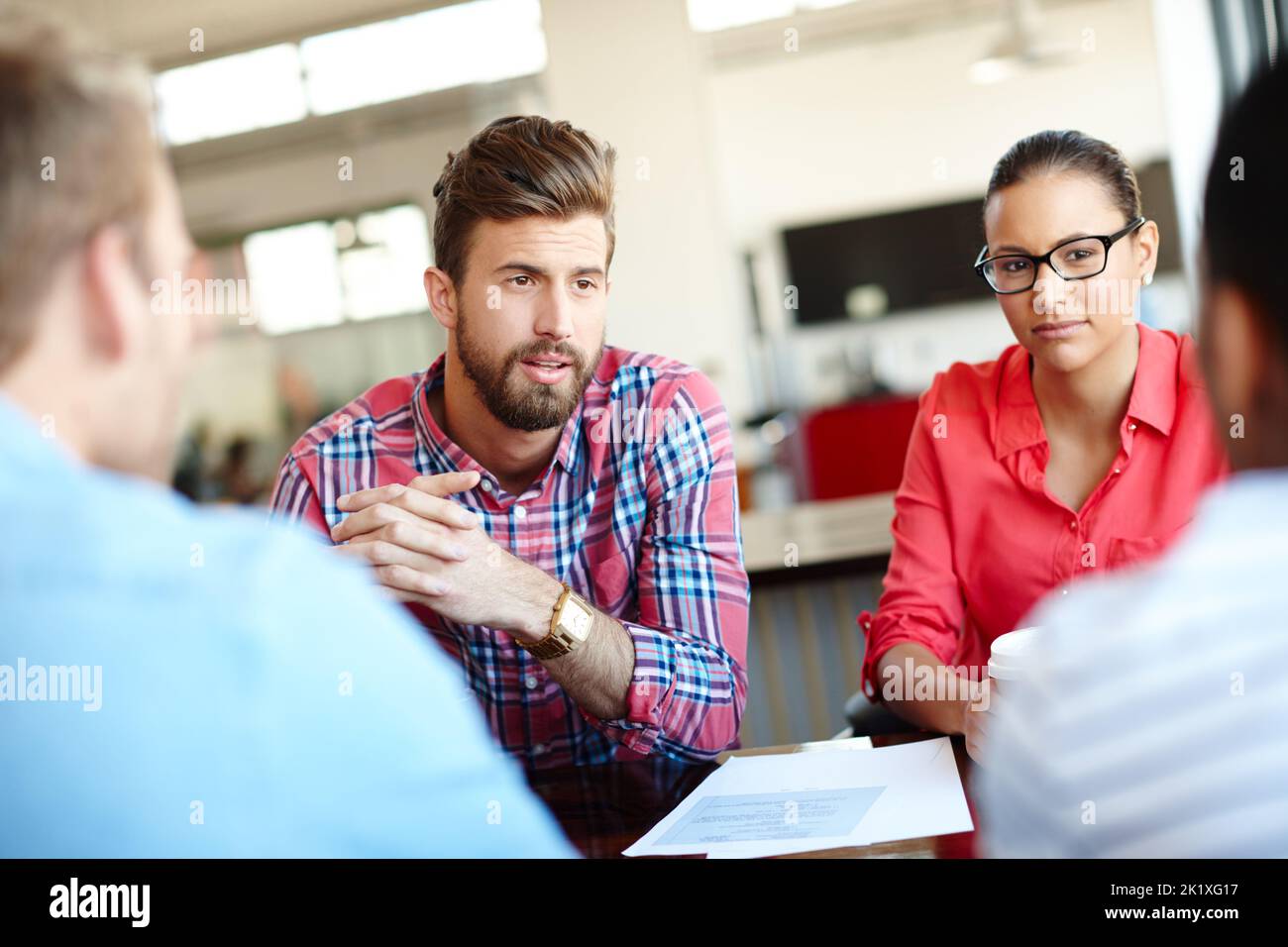 Share whats on your mind. a group of young designers in a meeting Stock ...