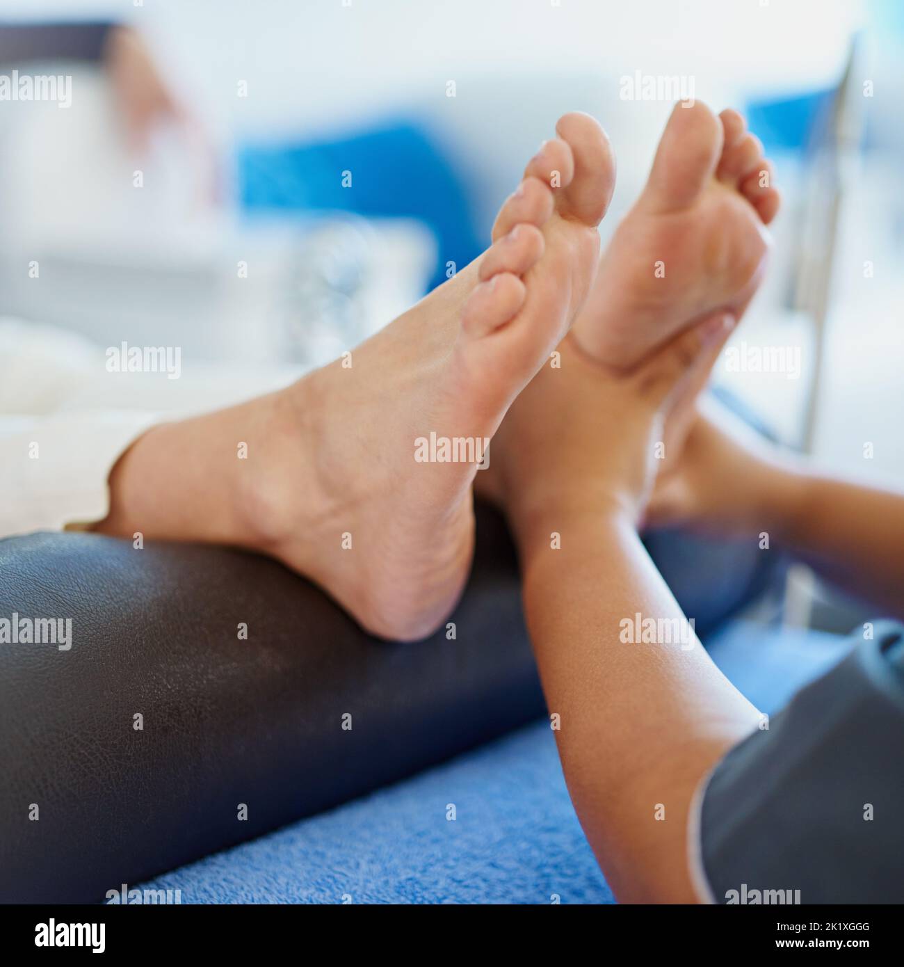 Relaxation From The Feet Up A Woman Having Her Feet Massaged At A