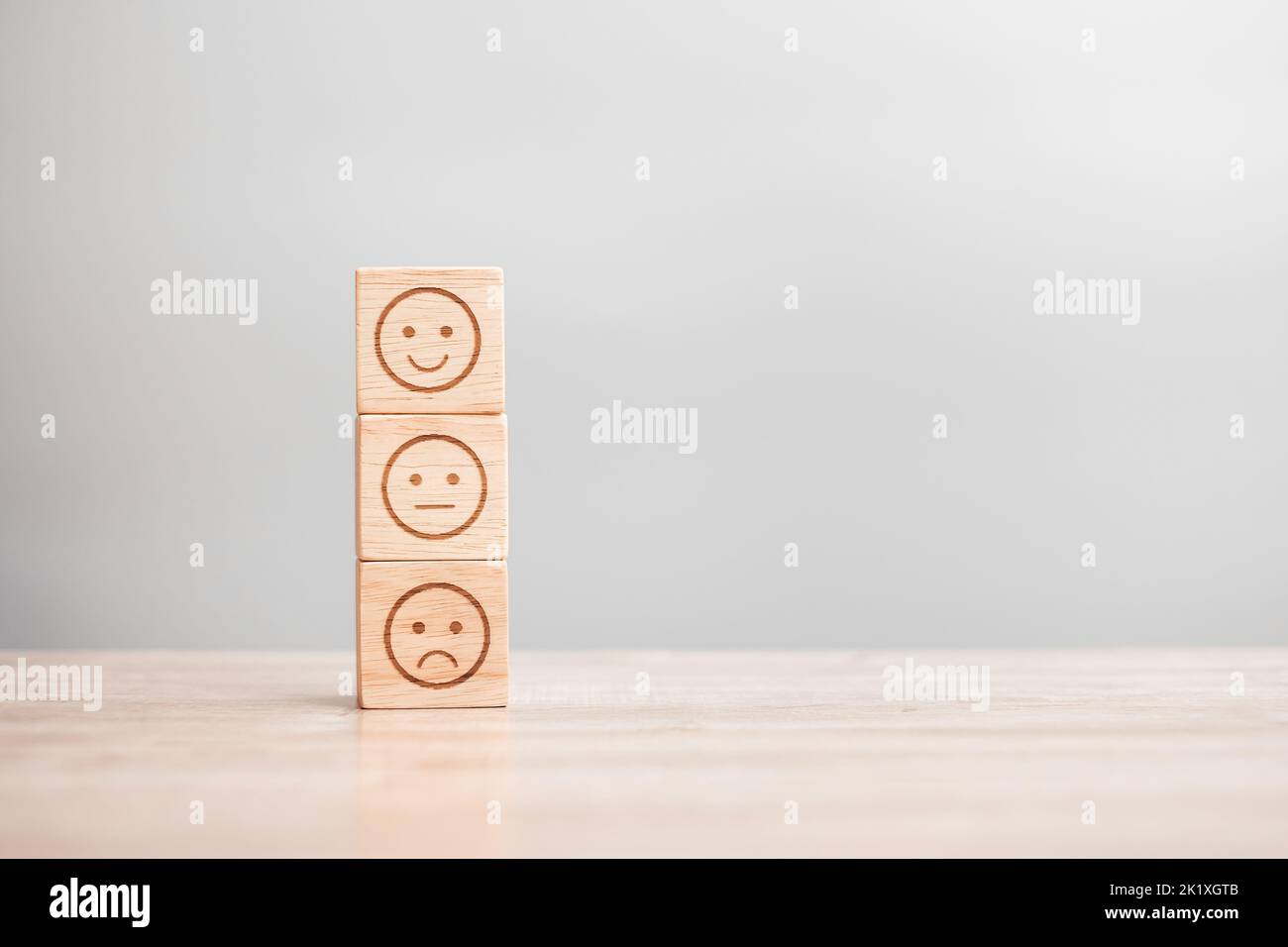 emotion face symbol on wooden blocks. Service rating, ranking, customer ...