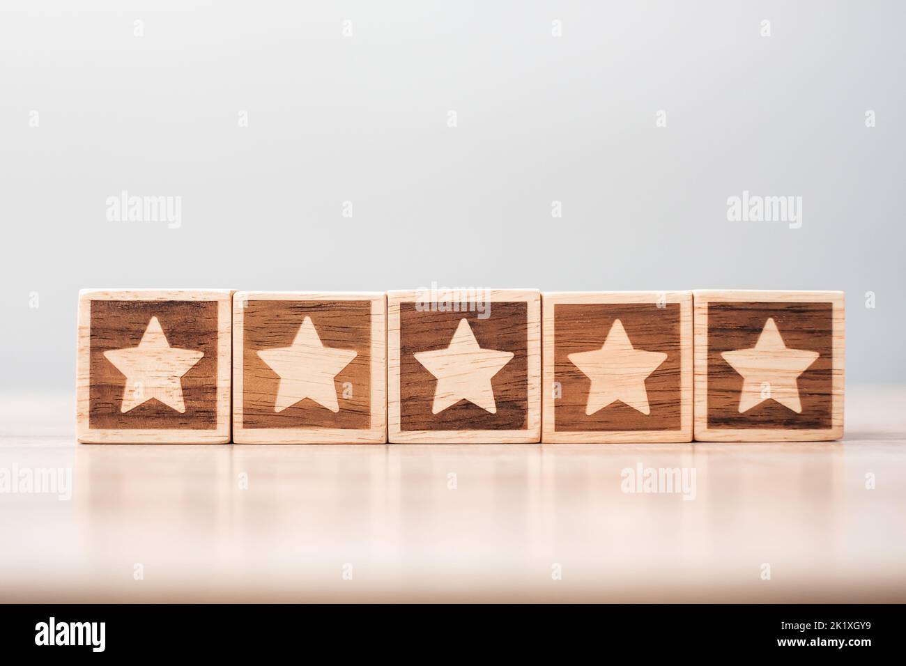 star symbol block on table background. Service rating, ranking ...